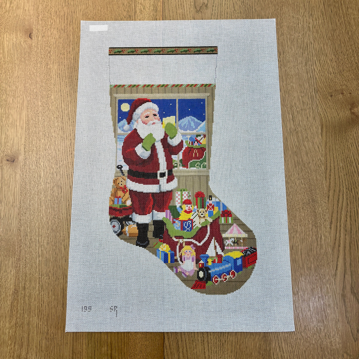 Santa Packing the Bags, Stocking – Susan Roberts Needlepoint